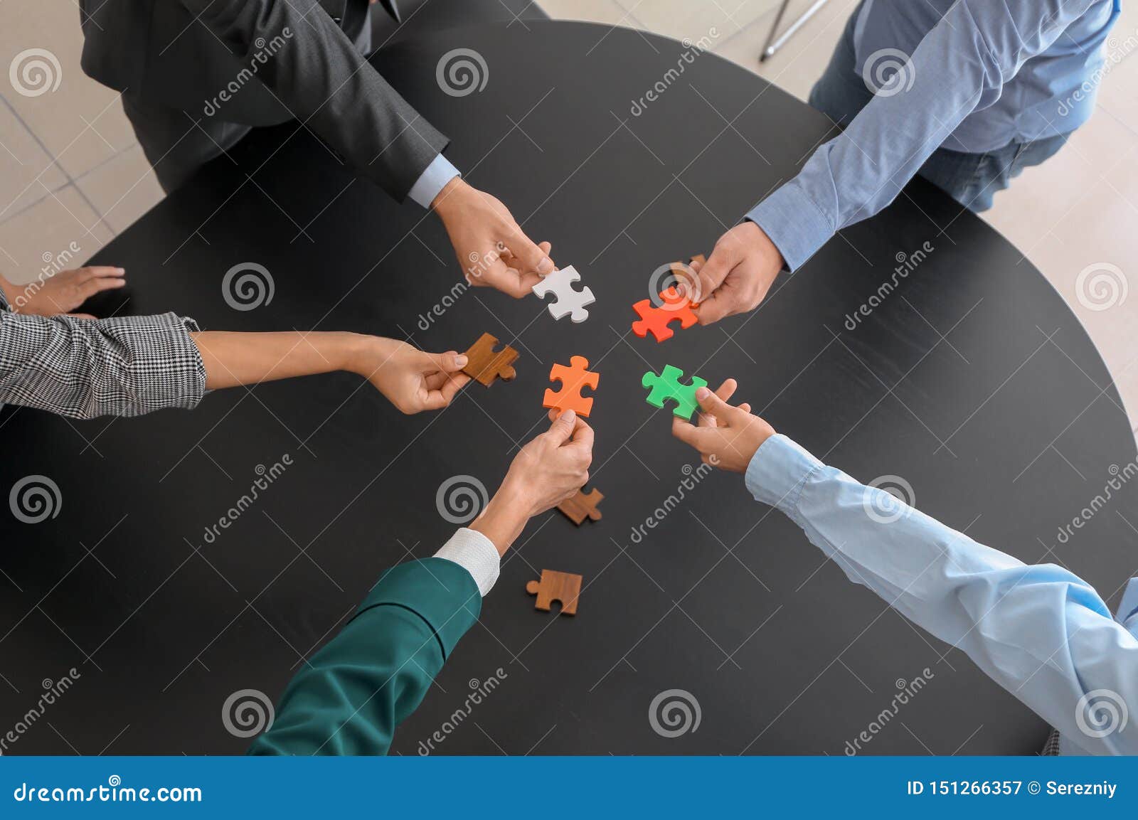 Business Team Assembling Puzzle on Dark Table Stock Image - Image of ...