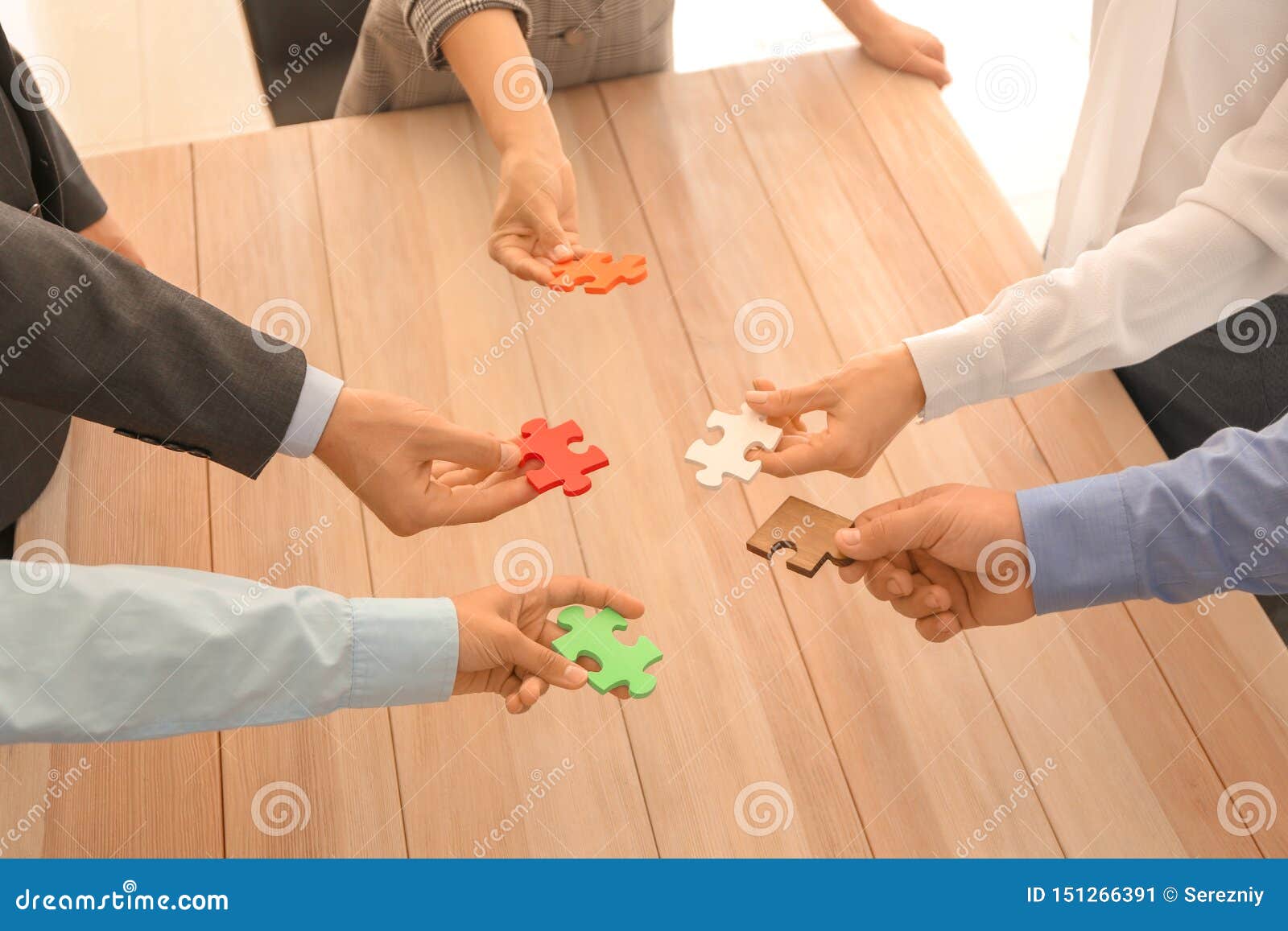 Business Team Assembling Puzzle on Wooden Table Stock Image - Image of ...