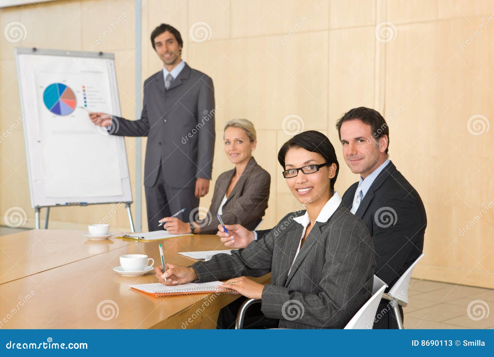 Business team in boardroom stock image. Image of graphic - 8690113