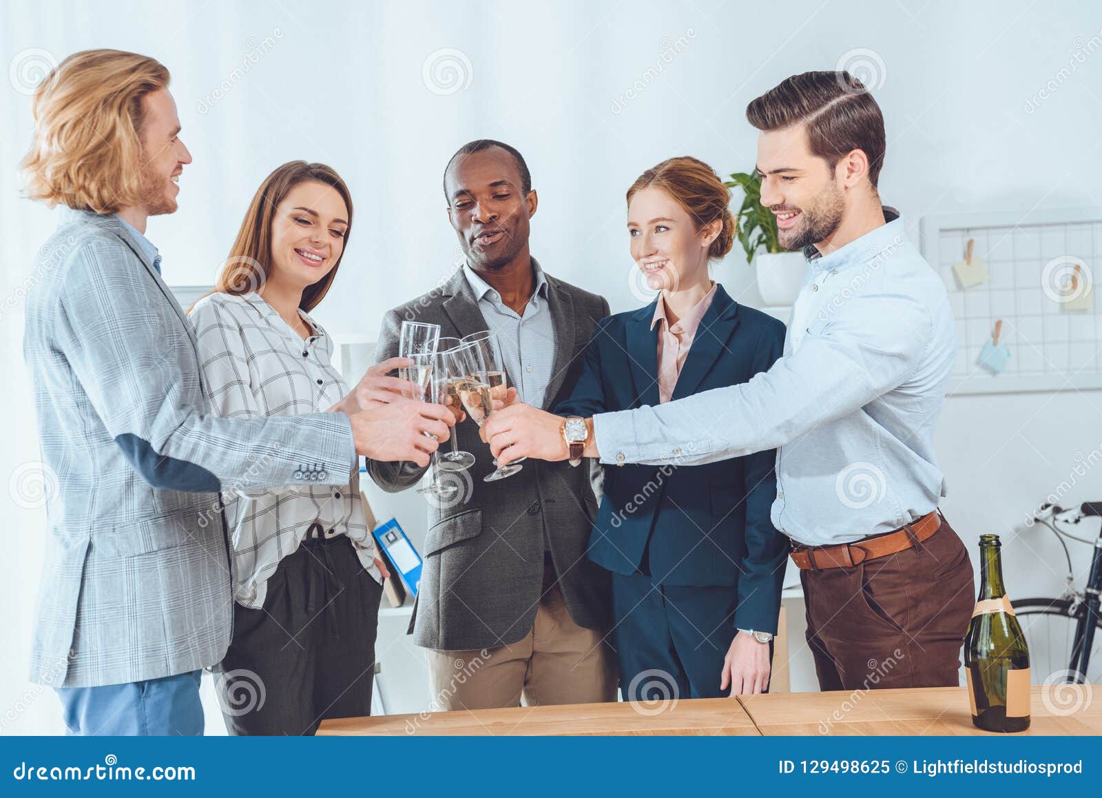 Business Team Celebrating with Beverage in Glasses at Office Space ...
