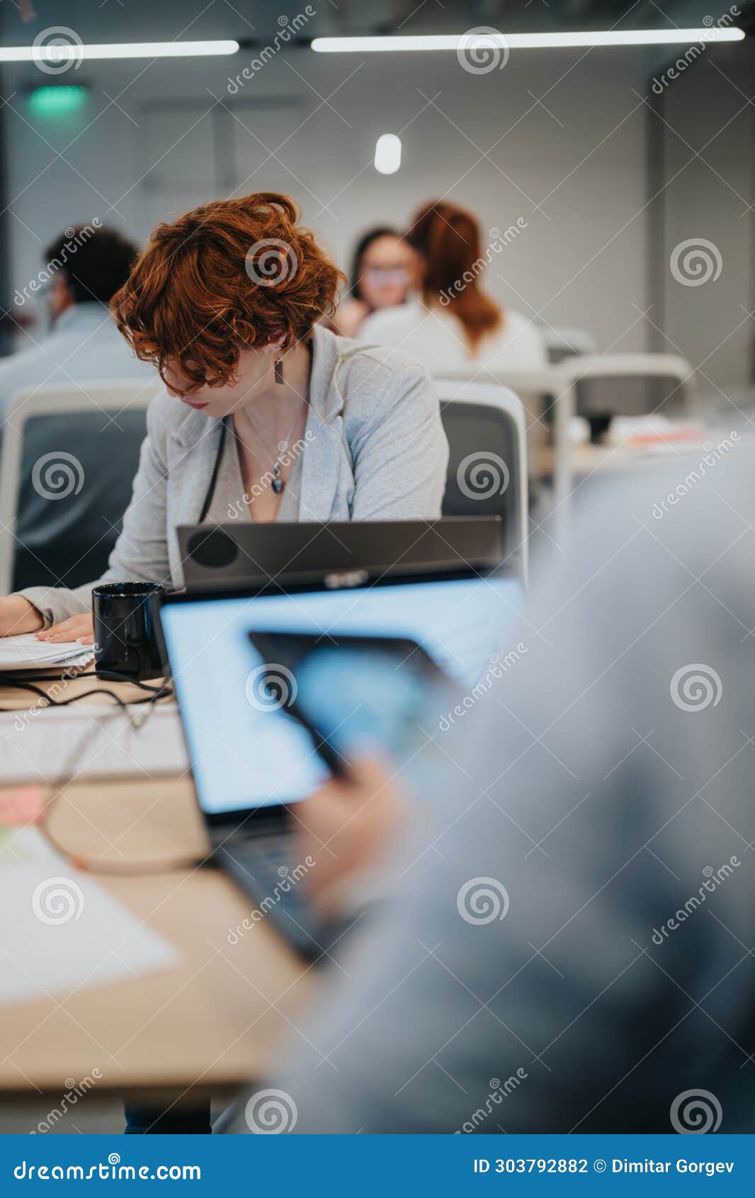 A Group of Business Professionals Collaborates in a Modern Office. they ... A Group of Business Professionals Collaborates in a Modern Office. they ...
