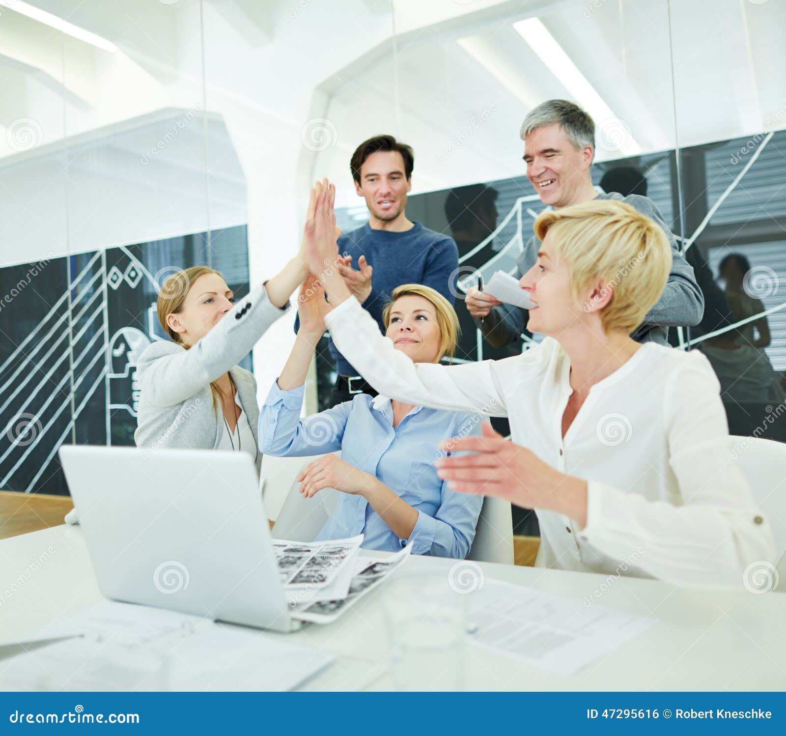 Business Team with Computer Giving High Five Stock Photo - Image of ...