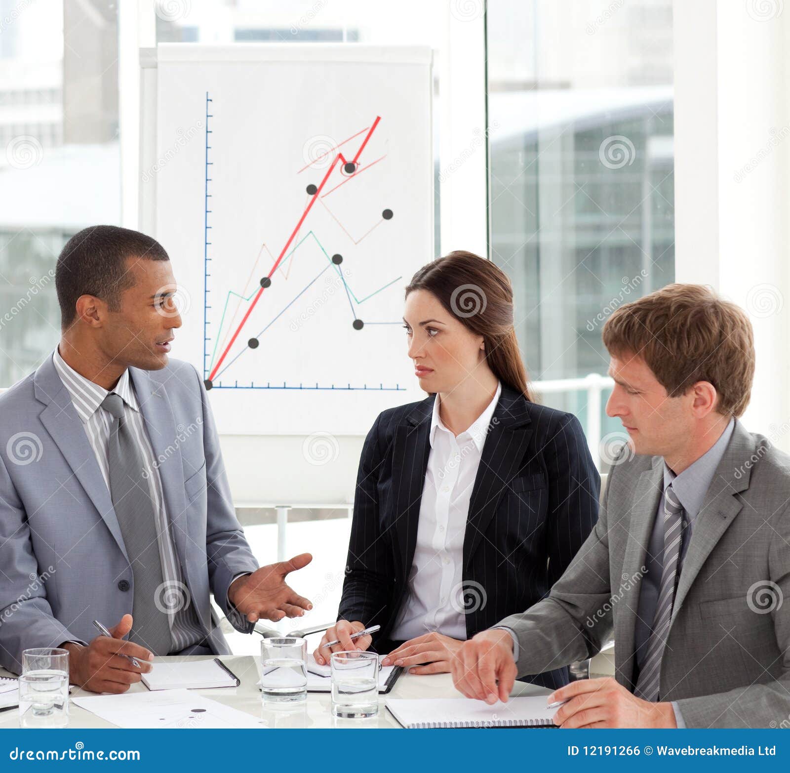 Business Team Conversing in a Business Meeting Stock Photo - Image of ...