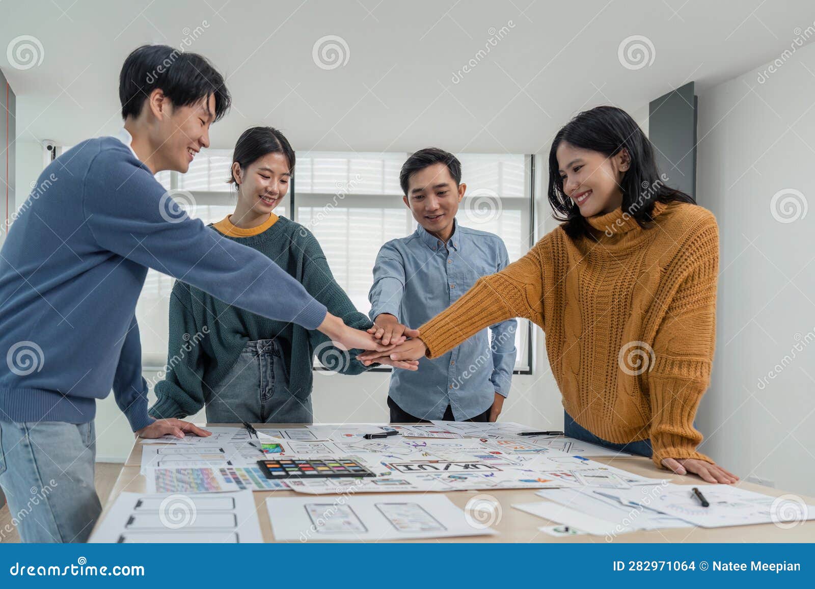 Business Team of Developers or Graphic Designers Putting Their Hands ...