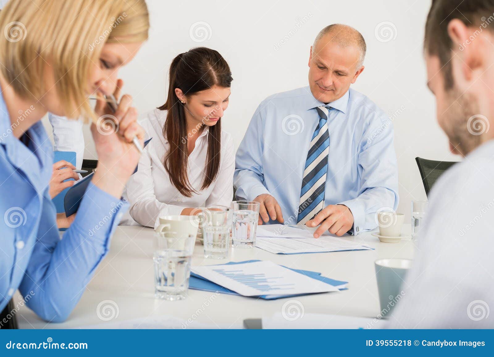 Business Team Discussing Document Stock Photo - Image of communication ...