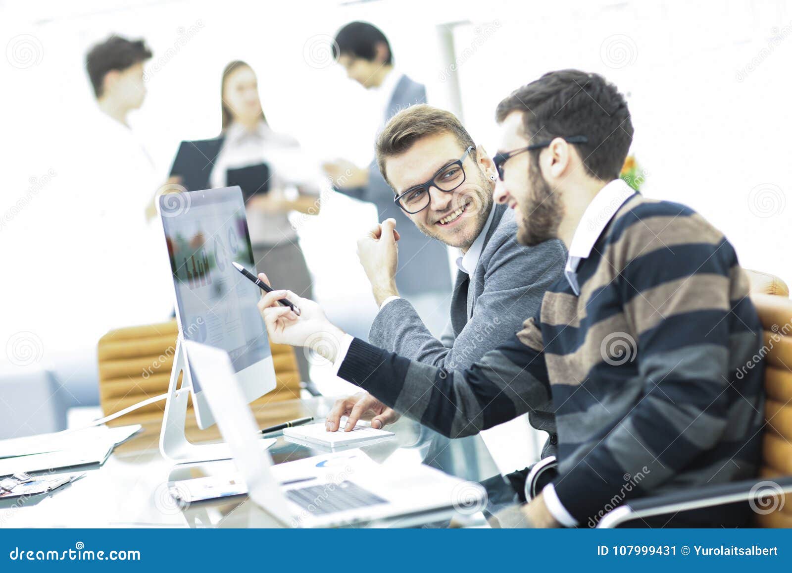 Business Team Discussing Marketing Schemes in the Workplace on the ... Business Team Discussing Marketing Schemes in the Workplace on the ...