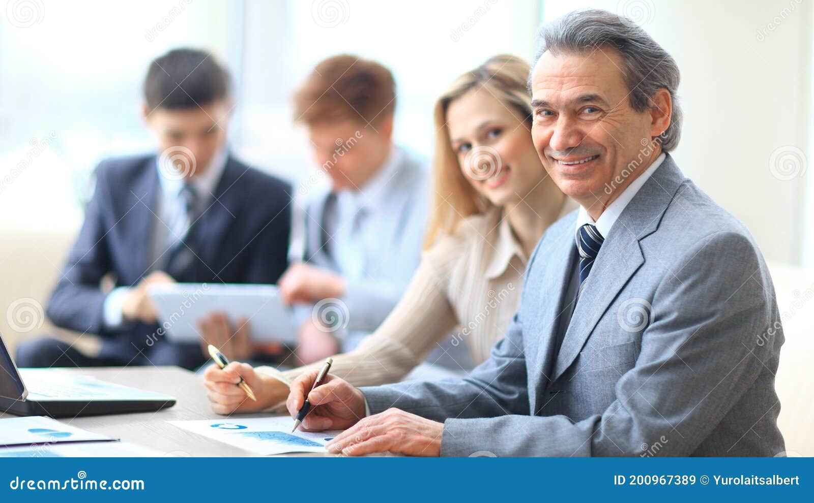 Business Team Discussing New Ideas Sitting at the Office Table. Stock ...