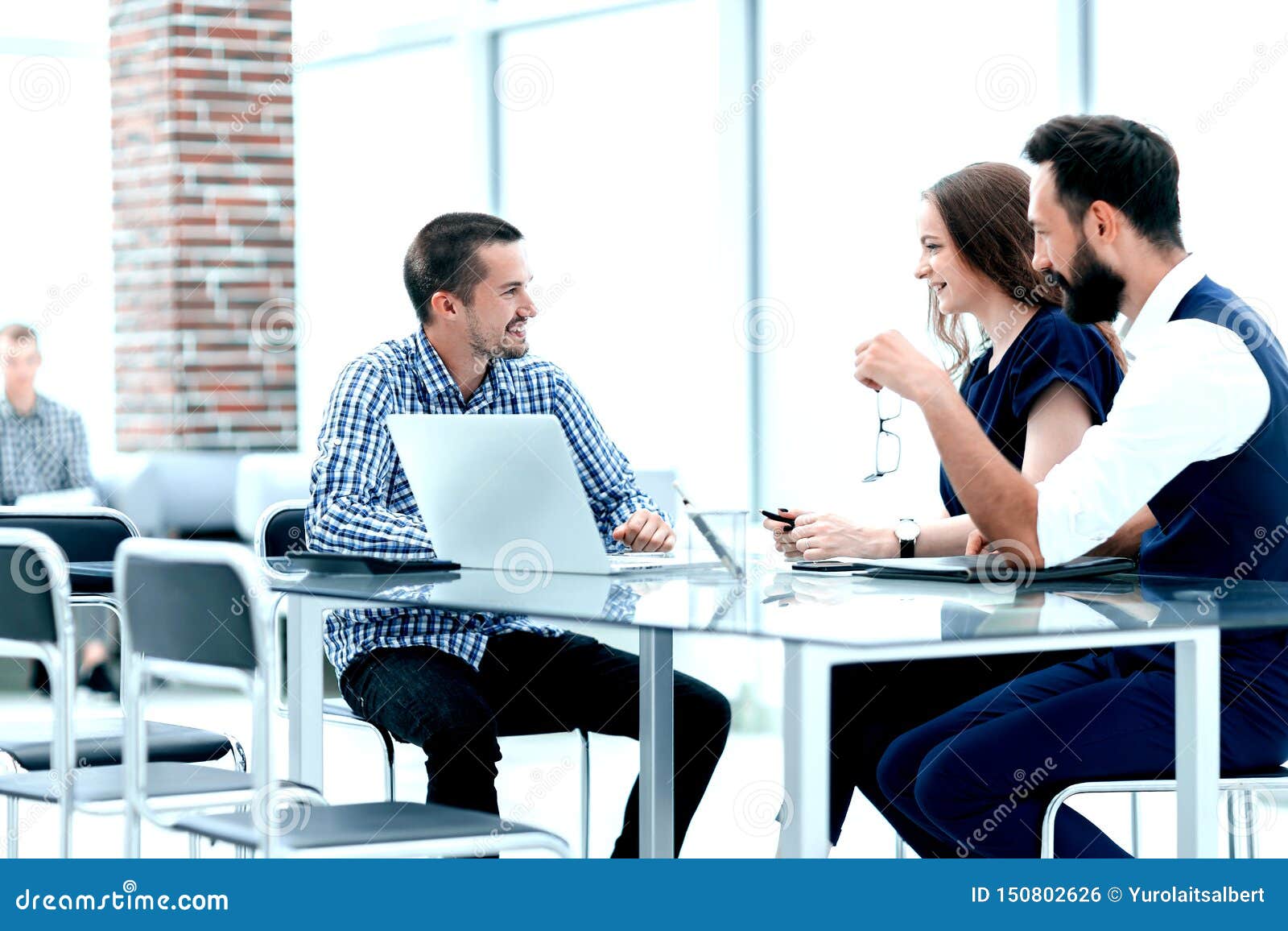 Business Team Discussing Something Sitting at the Office Table Stock ... Business Team Discussing Something Sitting at the Office Table Stock ...
