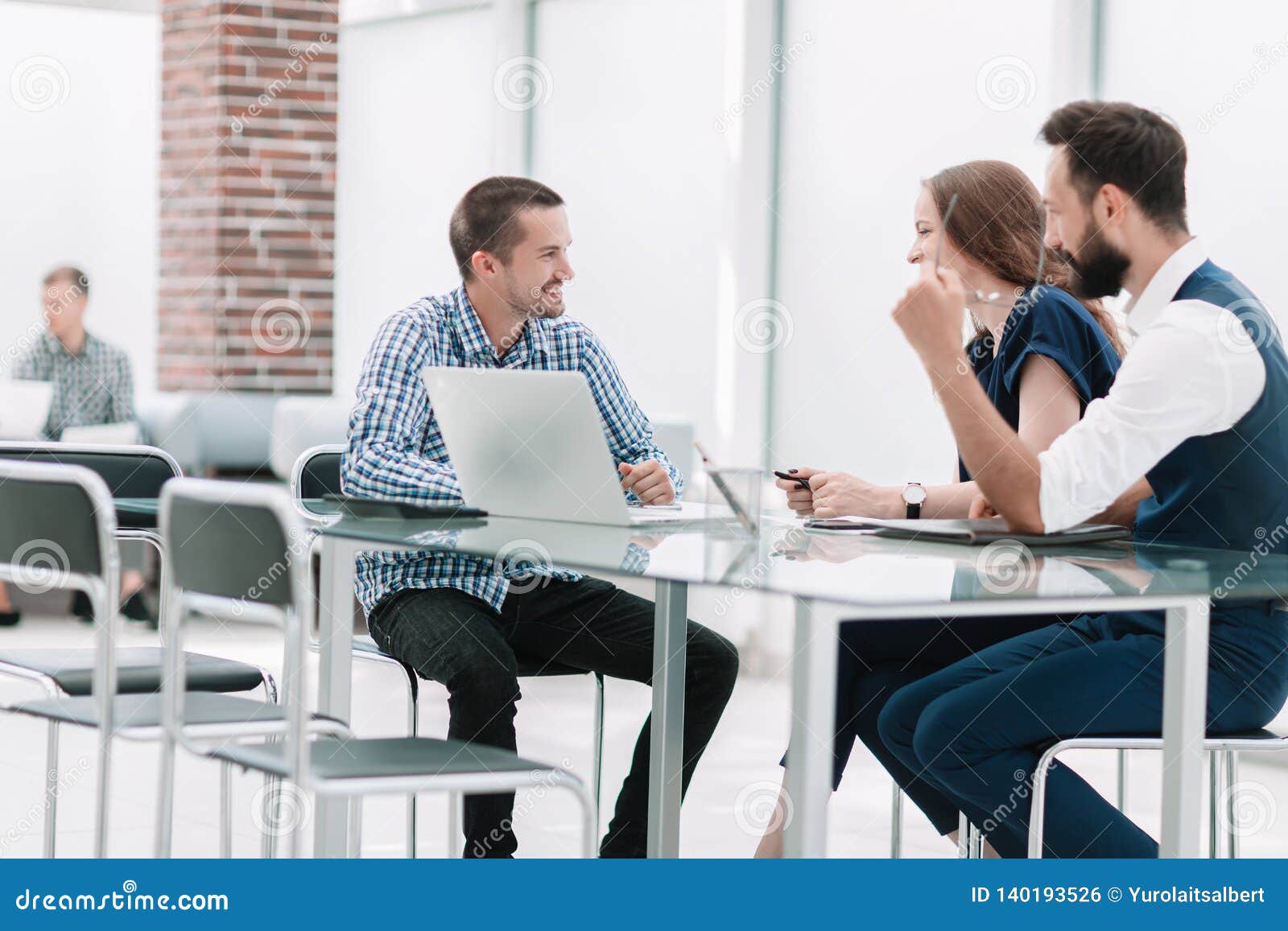 Business Team Discussing Something Sitting at the Office Table Stock ... Business Team Discussing Something Sitting at the Office Table Stock ...