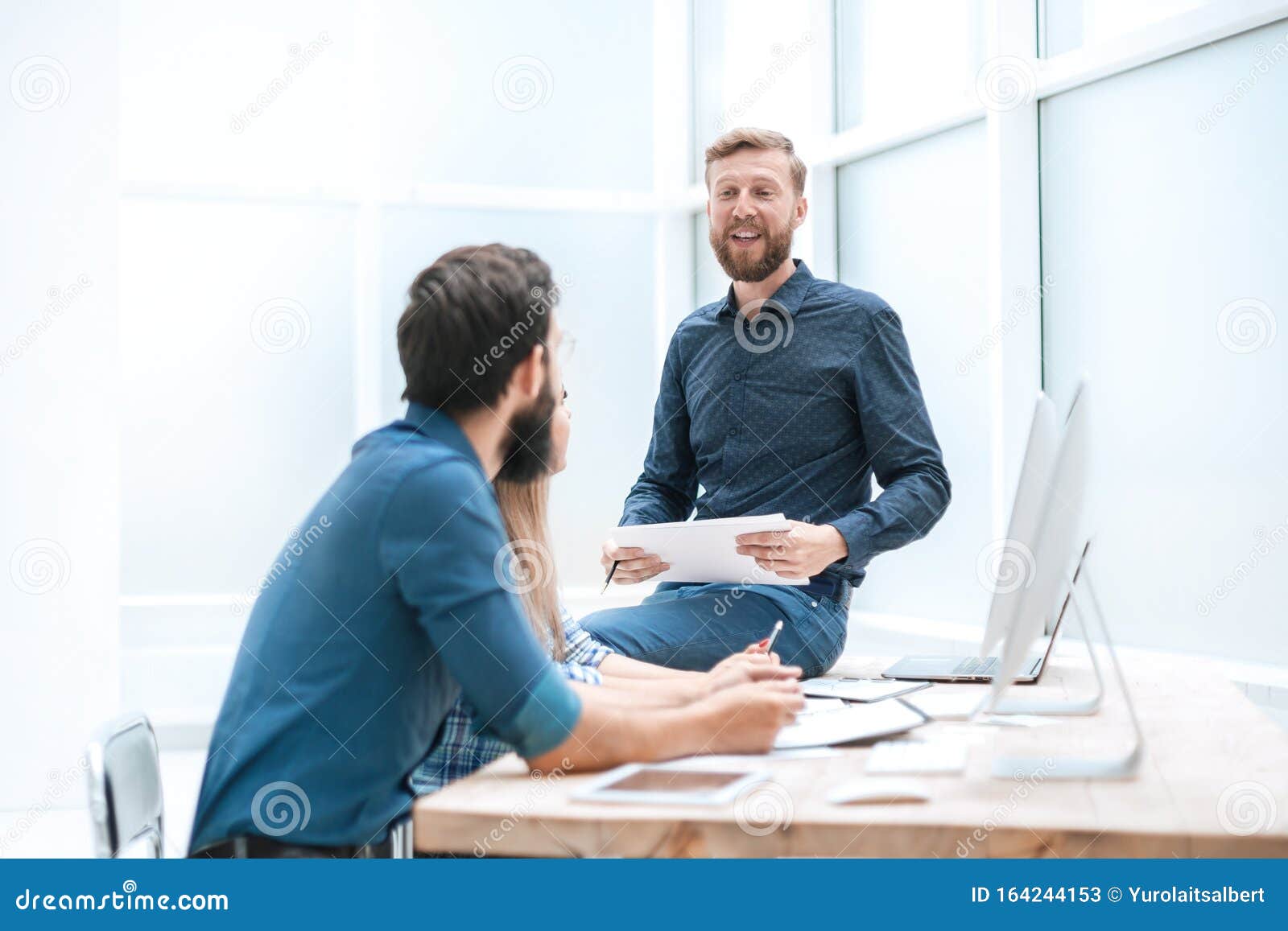 Business Team is Discussing Something at the Workplace in the Office ... Business Team is Discussing Something at the Workplace in the Office ...