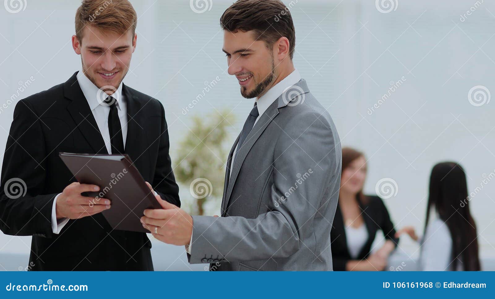 Two Successful Business Partners Discussing Documents and Ideas Stock ...