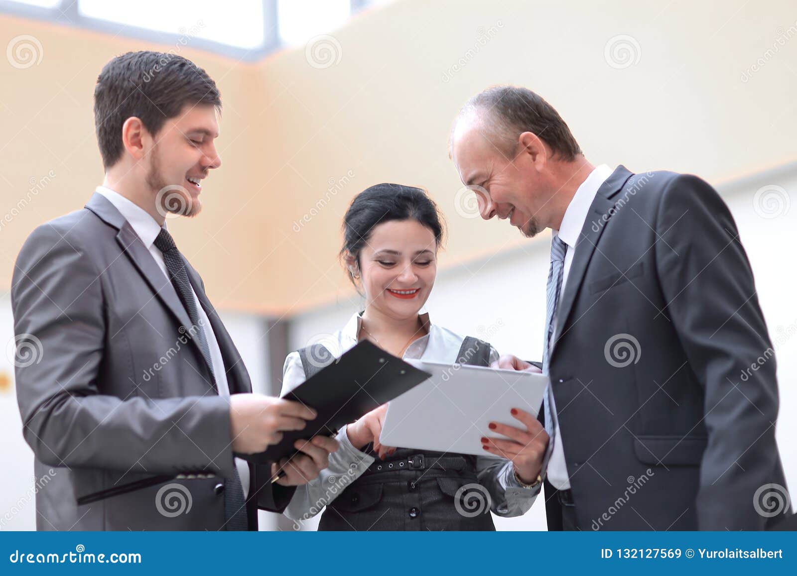 Business Team Discussing Work Issues Standing in the Office Stock Image ...