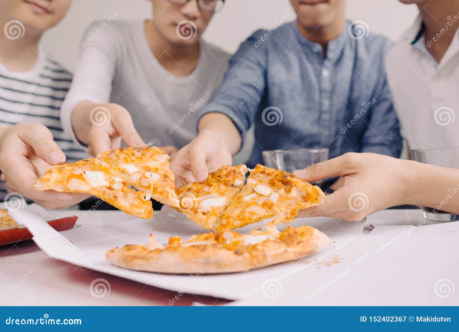 Business Team is Eating Pizza at Work while Working Stock Image - Image ...