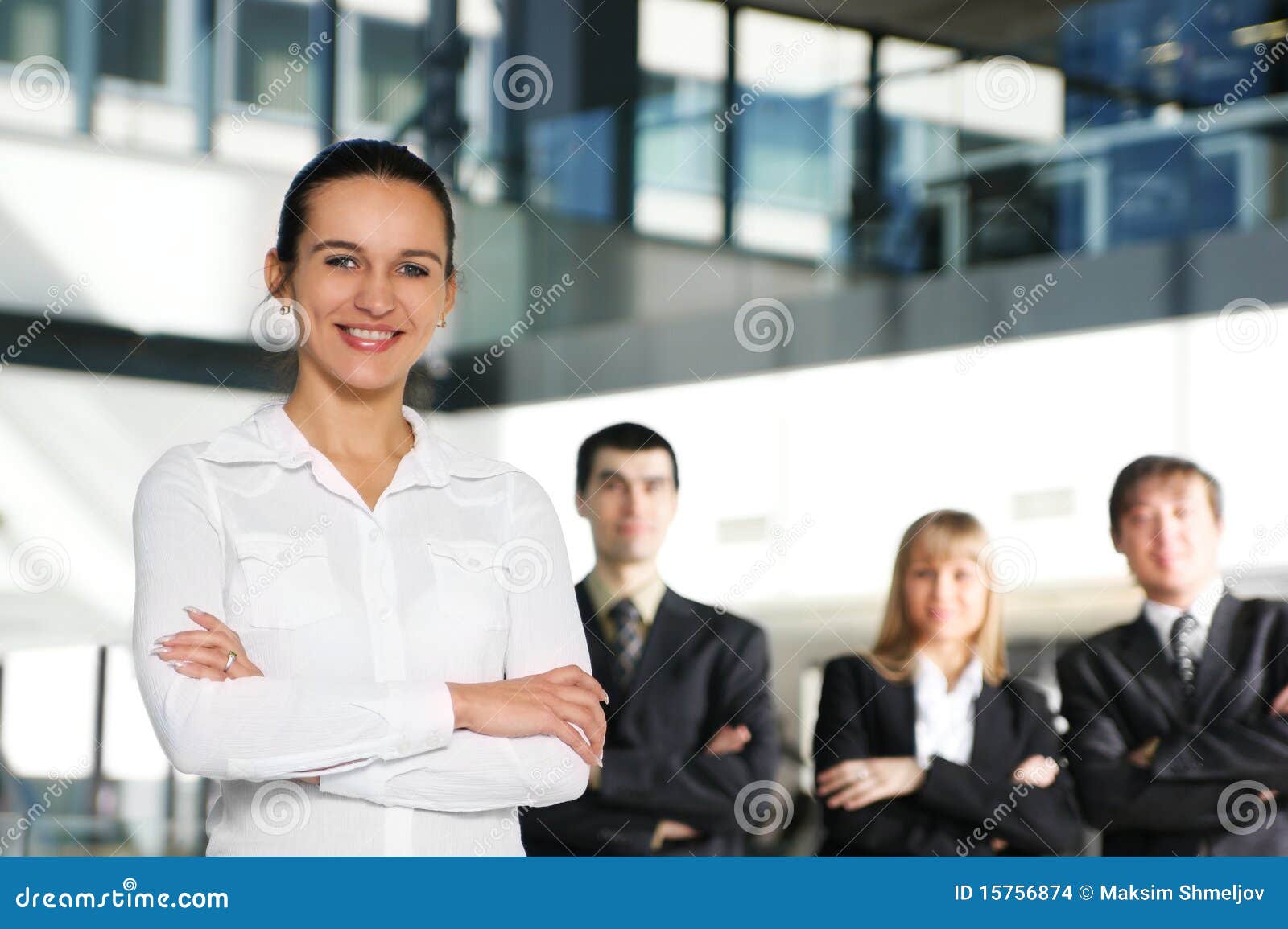 A Business Team of Four Persons in a Modern Office Stock Photo - Image ...