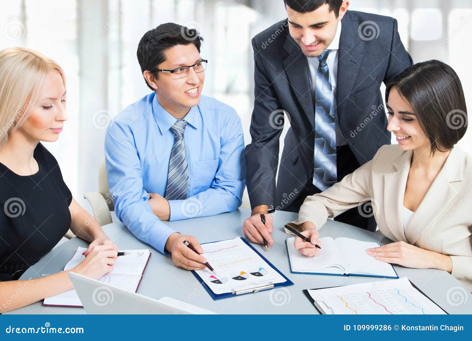 A Business Team of Four Plan Work Stock Photo - Image of explaining ...