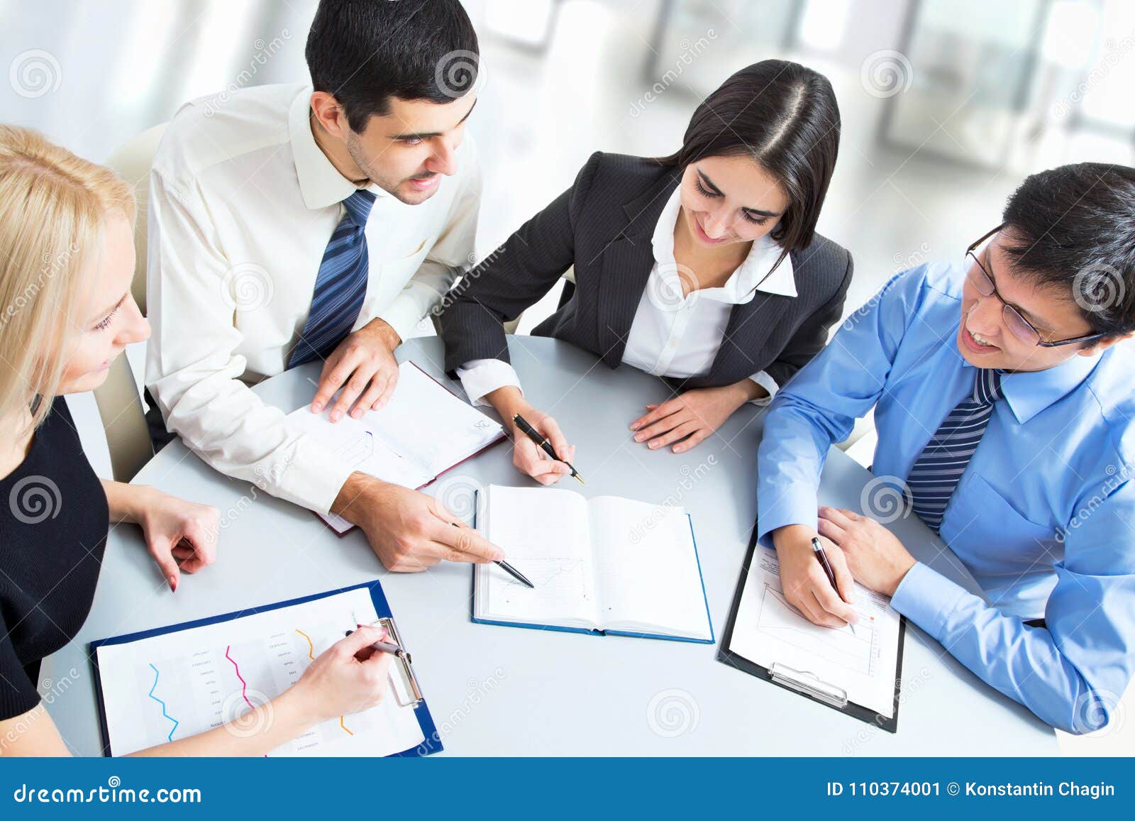 A Business Team of Four Plan Work Stock Image - Image of office, group ...