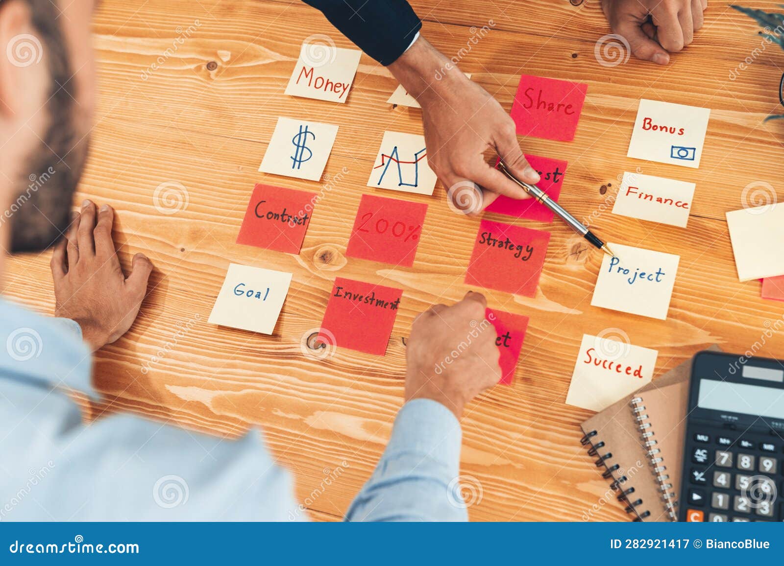 Business Team Gather on Table, Brainstorming and Writing Creative Idea ...