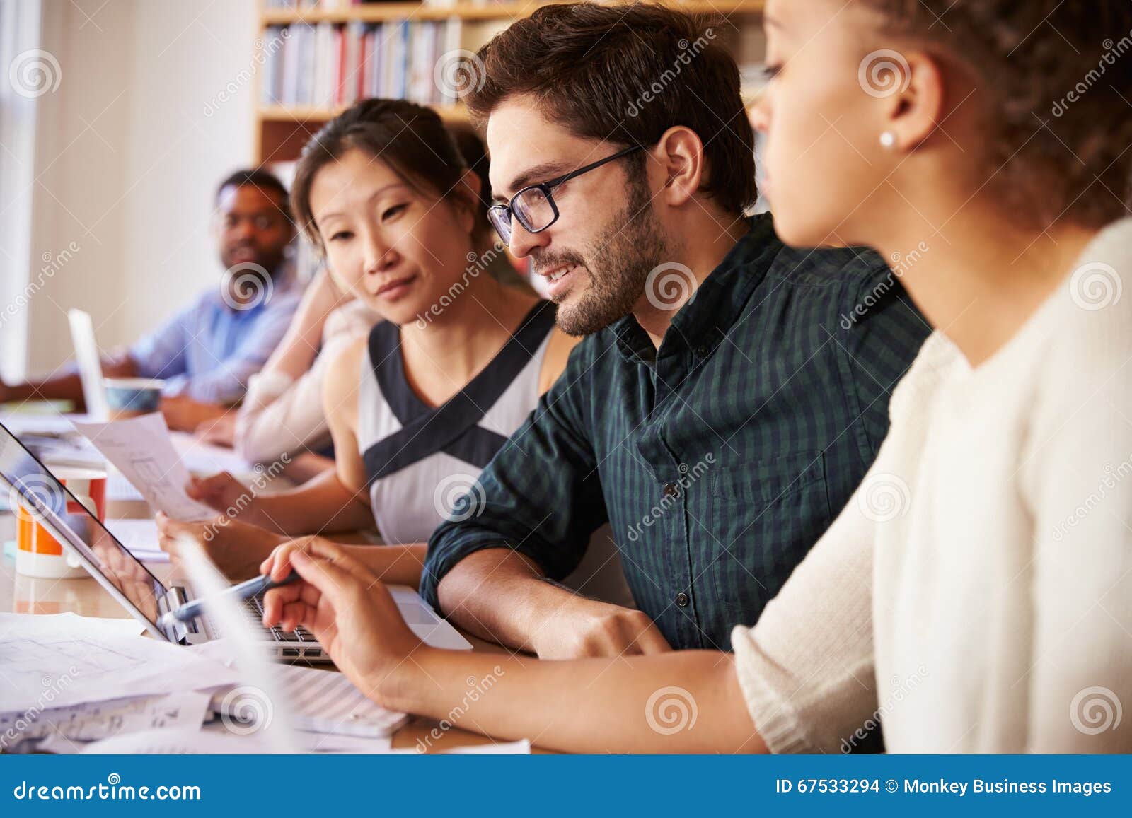 Business Team Having Meeting in Busy Office Stock Photo - Image of ...