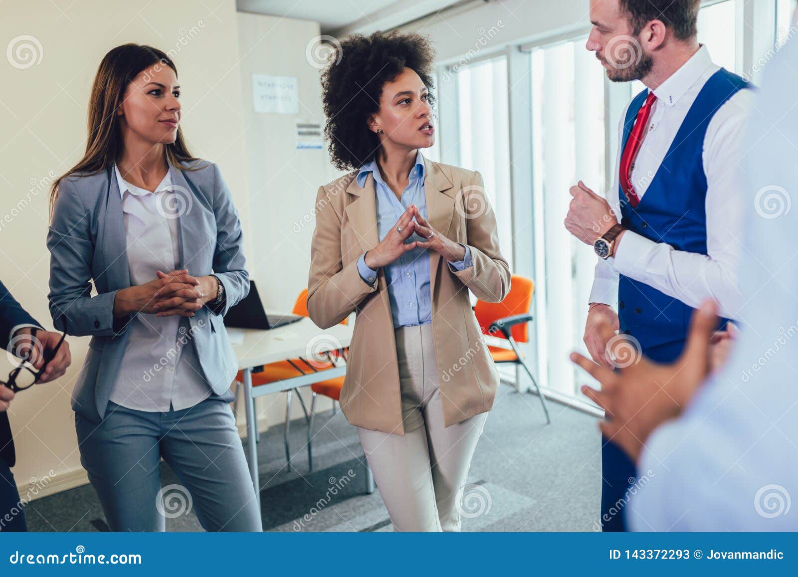 Business Team Having a Meeting Standing in the Office. Stock Image ...