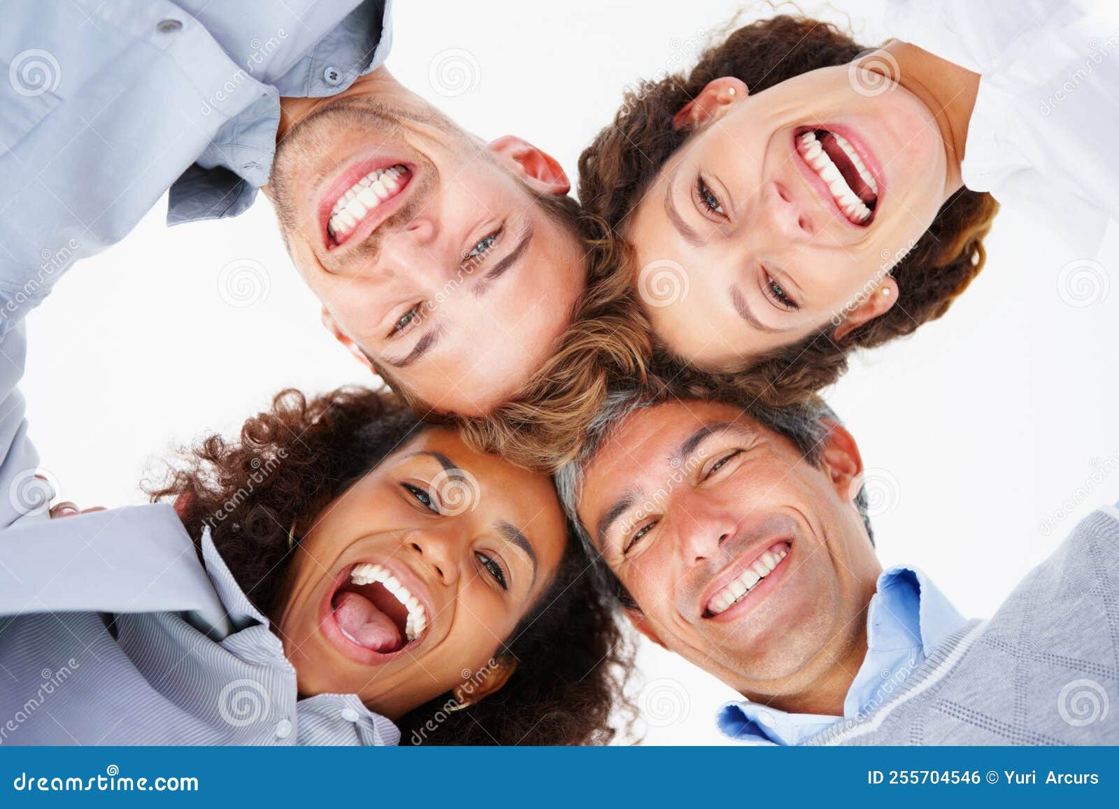 Business Team in a Huddle. Low Angle View of Business Team in a Huddle ...