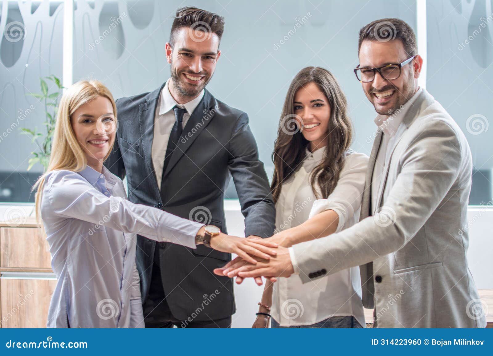 Business Team Joining Hands Together in Office. Stock Photo - Image of ...