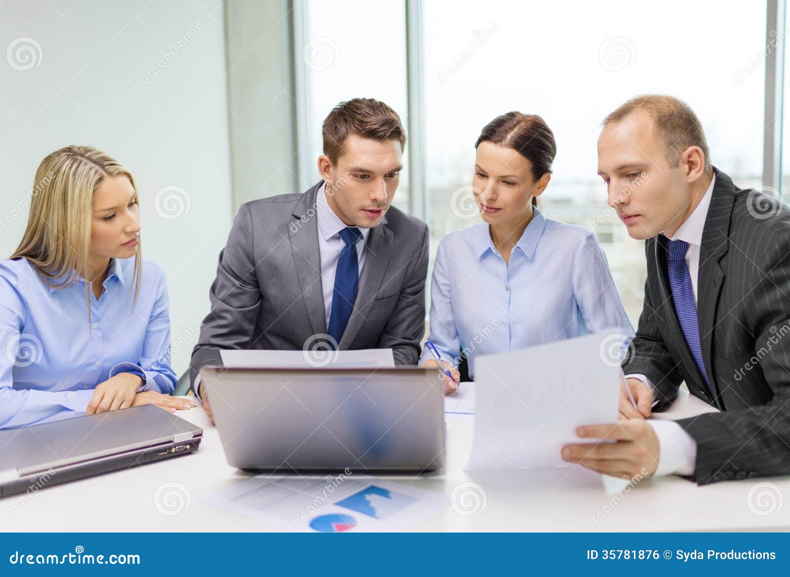 Business Team with Laptop Having Discussion Stock Photo - Image of ...