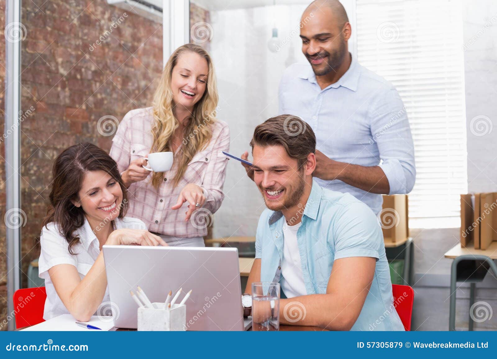 Business Team Laughing Together in Front of the Laptop Stock Image ...