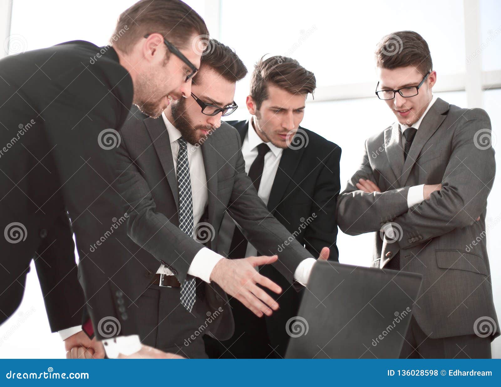 Business Team Looking Closely at the Laptop Screen. Stock Photo - Image ...