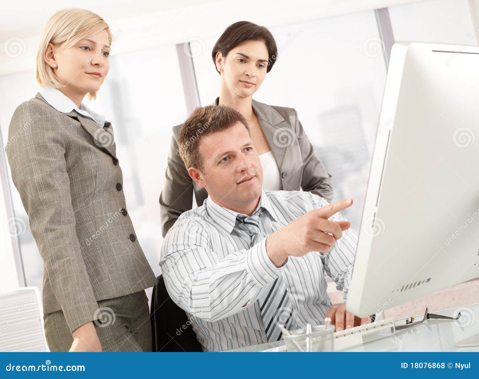 Business Team Looking at Computer Stock Photo - Image of employee, desk ...