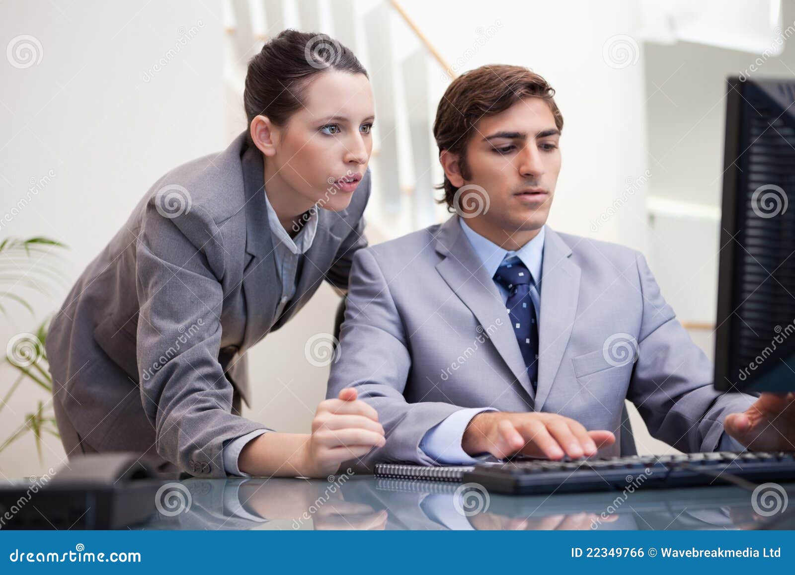 Business Team Looking at Computer Screen Together Stock Photo - Image ...