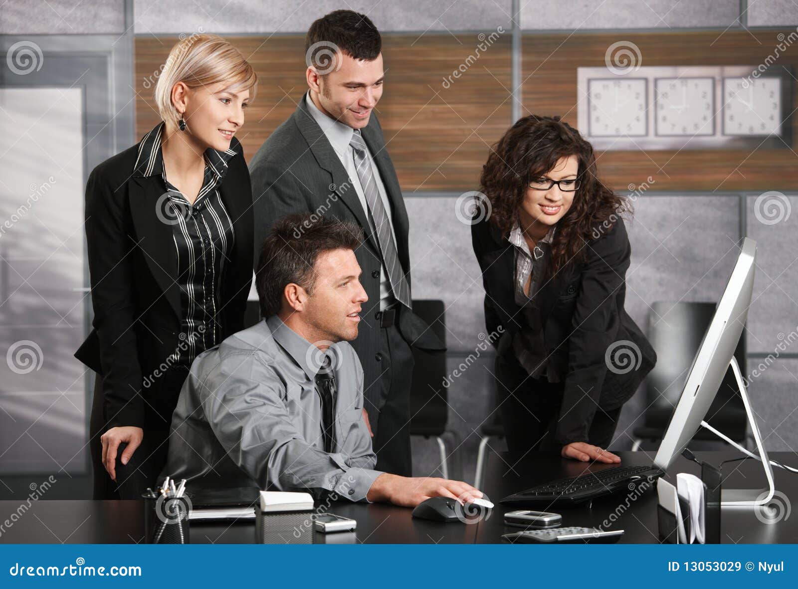 Business Team Looking at Screen Stock Image - Image of four, dark: 13053029
