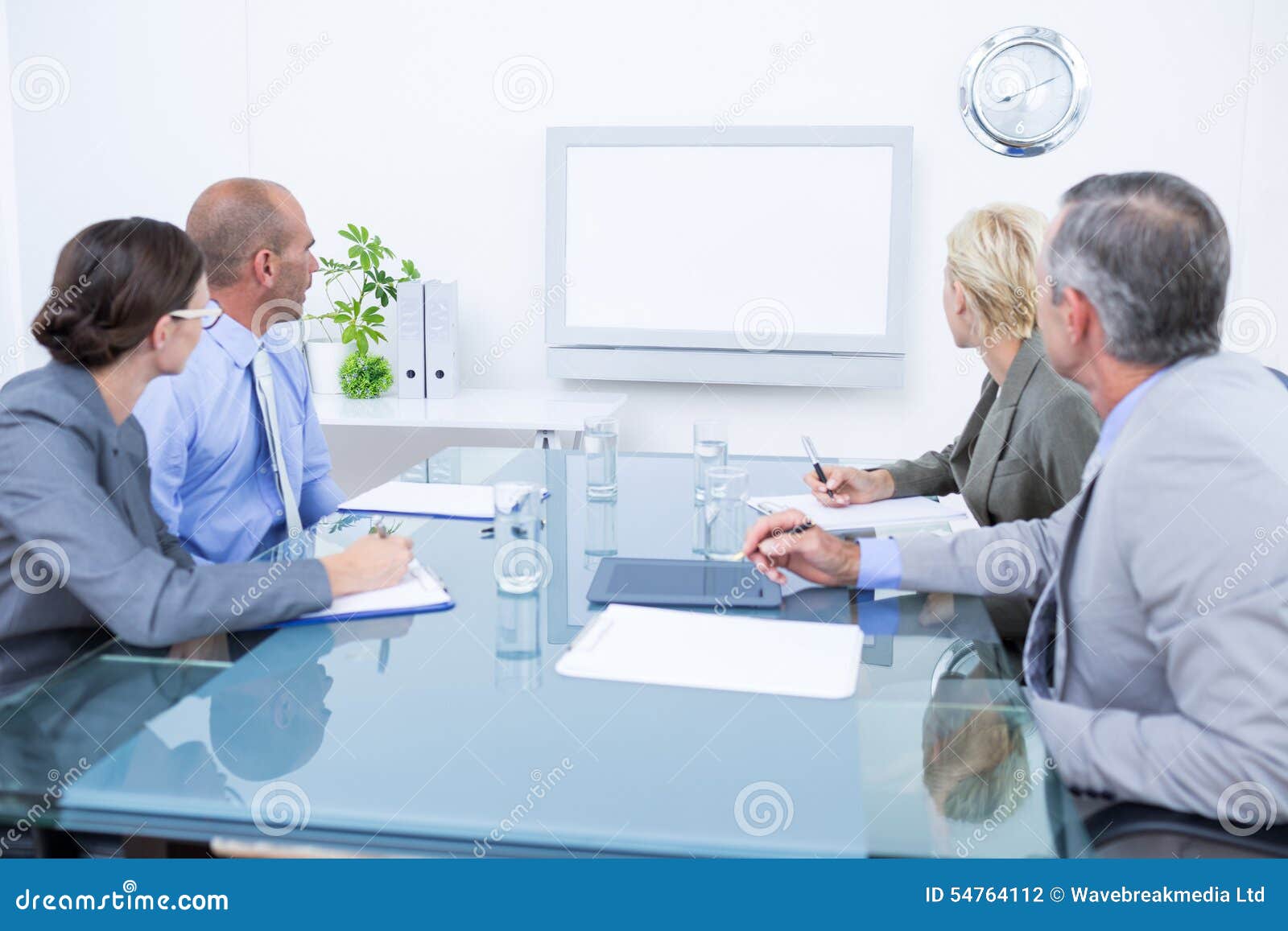 Business Team Looking at Time Clock Stock Photo - Image of desk ...
