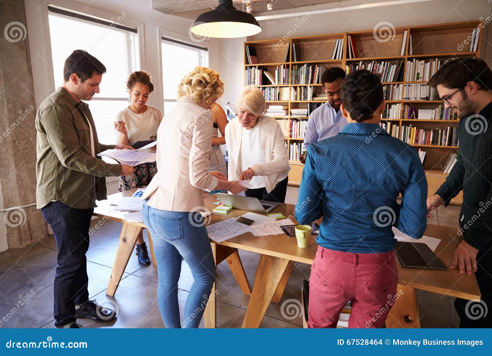 Business Team Meeting Around Table for Brainstorming Session Stock ...