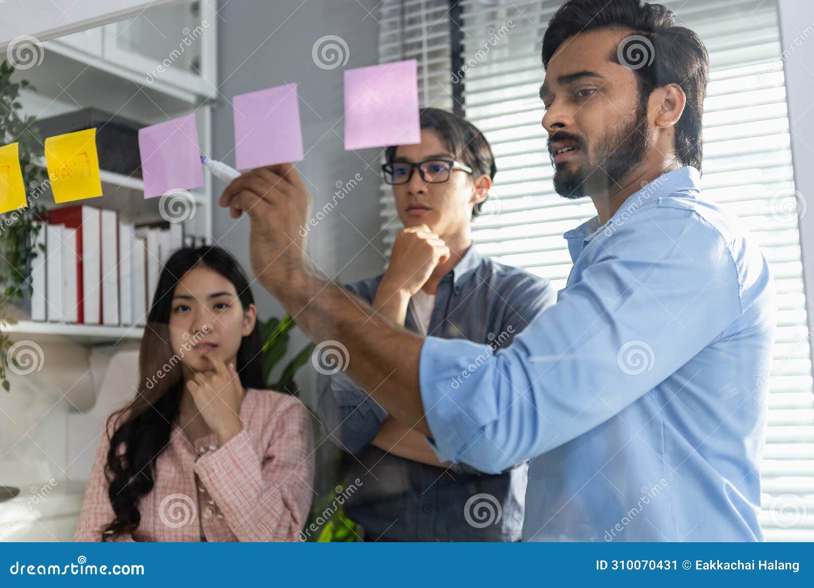 Business Team Meeting Planning New Strategy Using Colored Sticky Notes ...