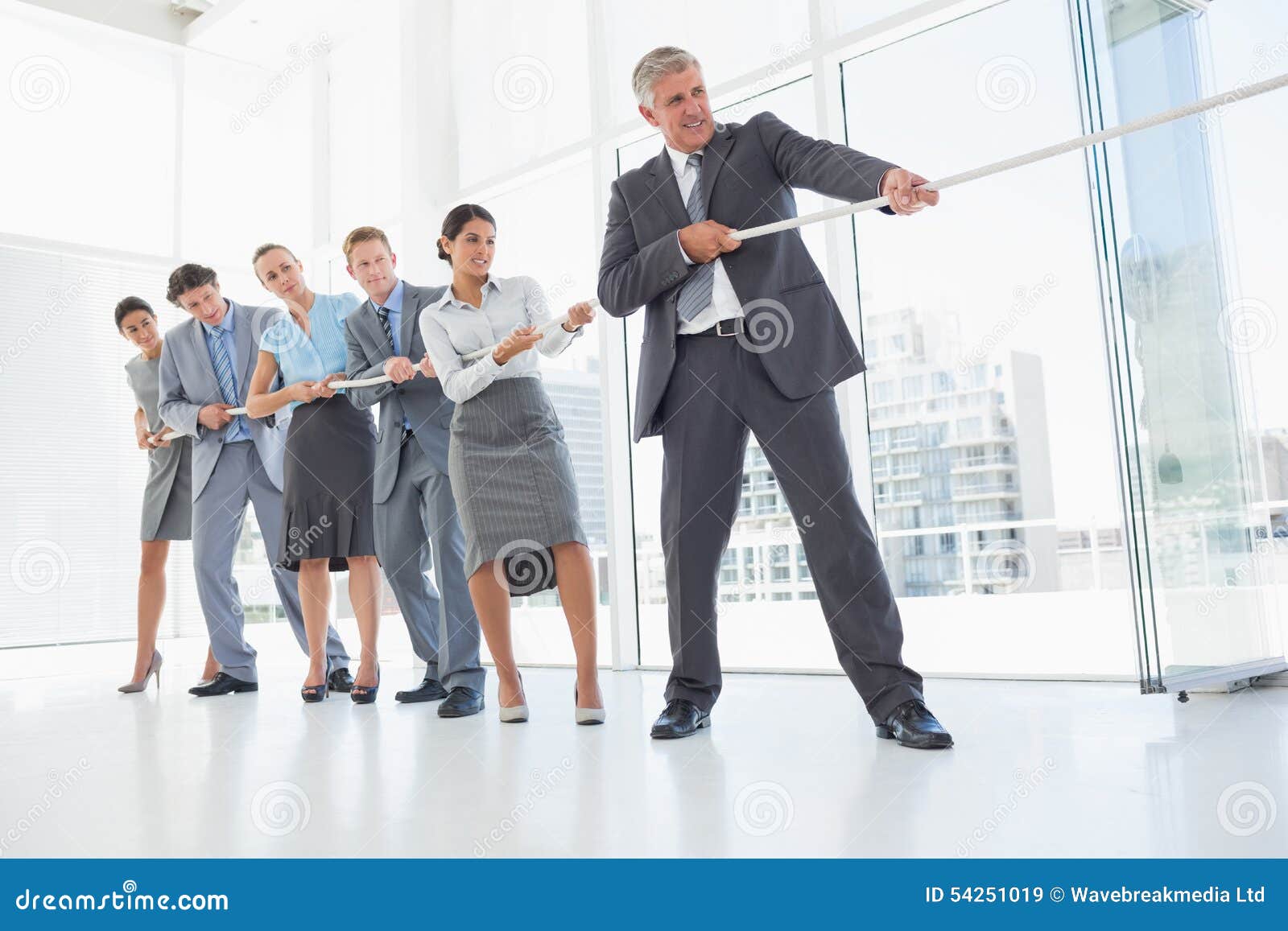 Team Pulling Line Together. Tug Of War Royalty-Free Stock Photography ...