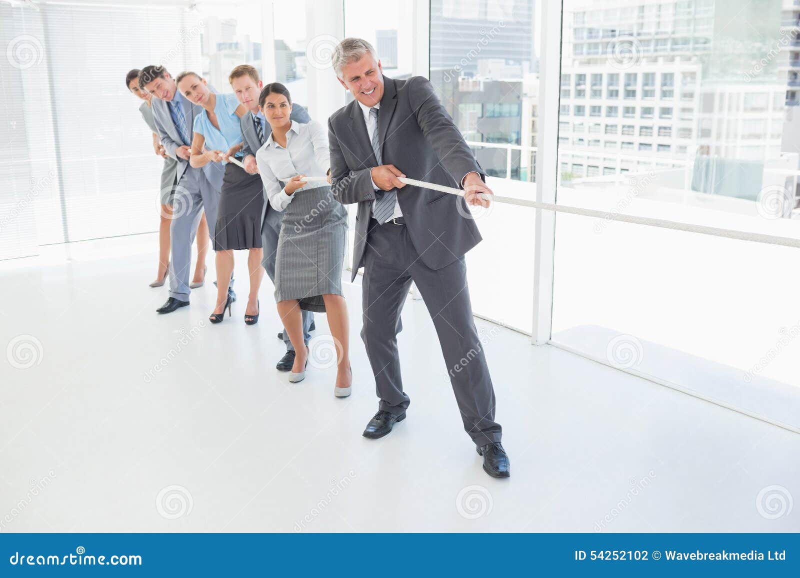 Team Pulling Line Together. Tug Of War Royalty-Free Stock Photography ...