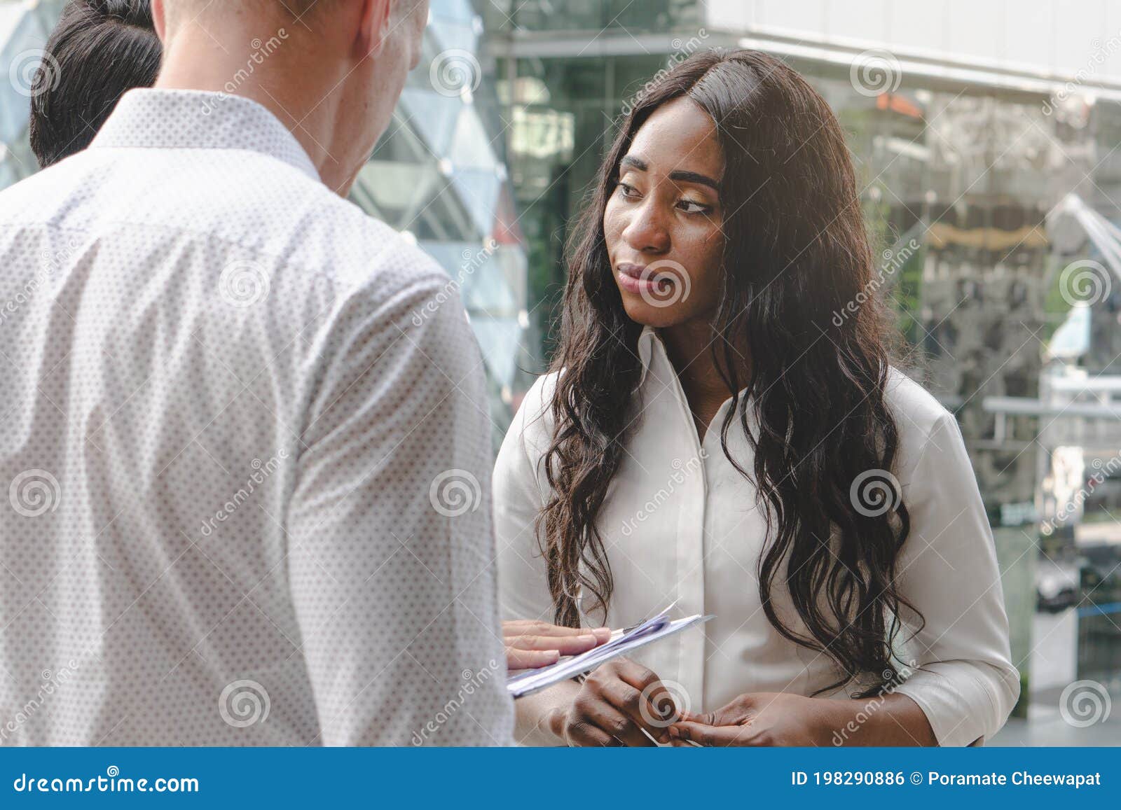 Business Team Reviewing Document Presentation. Multicultural Colleagues ...