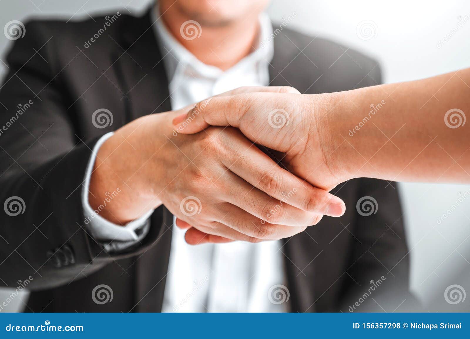 Business Team Shaking Hands during a Meeting Planning Strategy Analysis ...