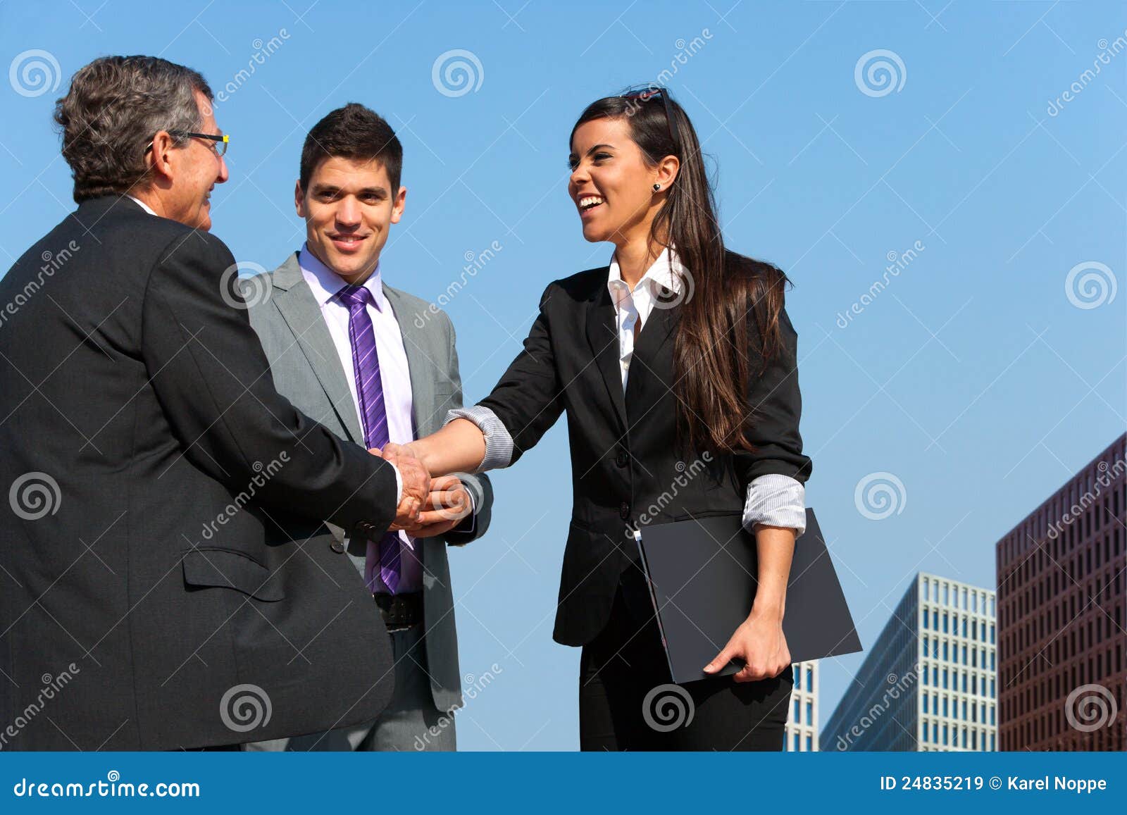 Business Team Shaking Hands Over Deal Outdoors. Stock Image - Image of ...