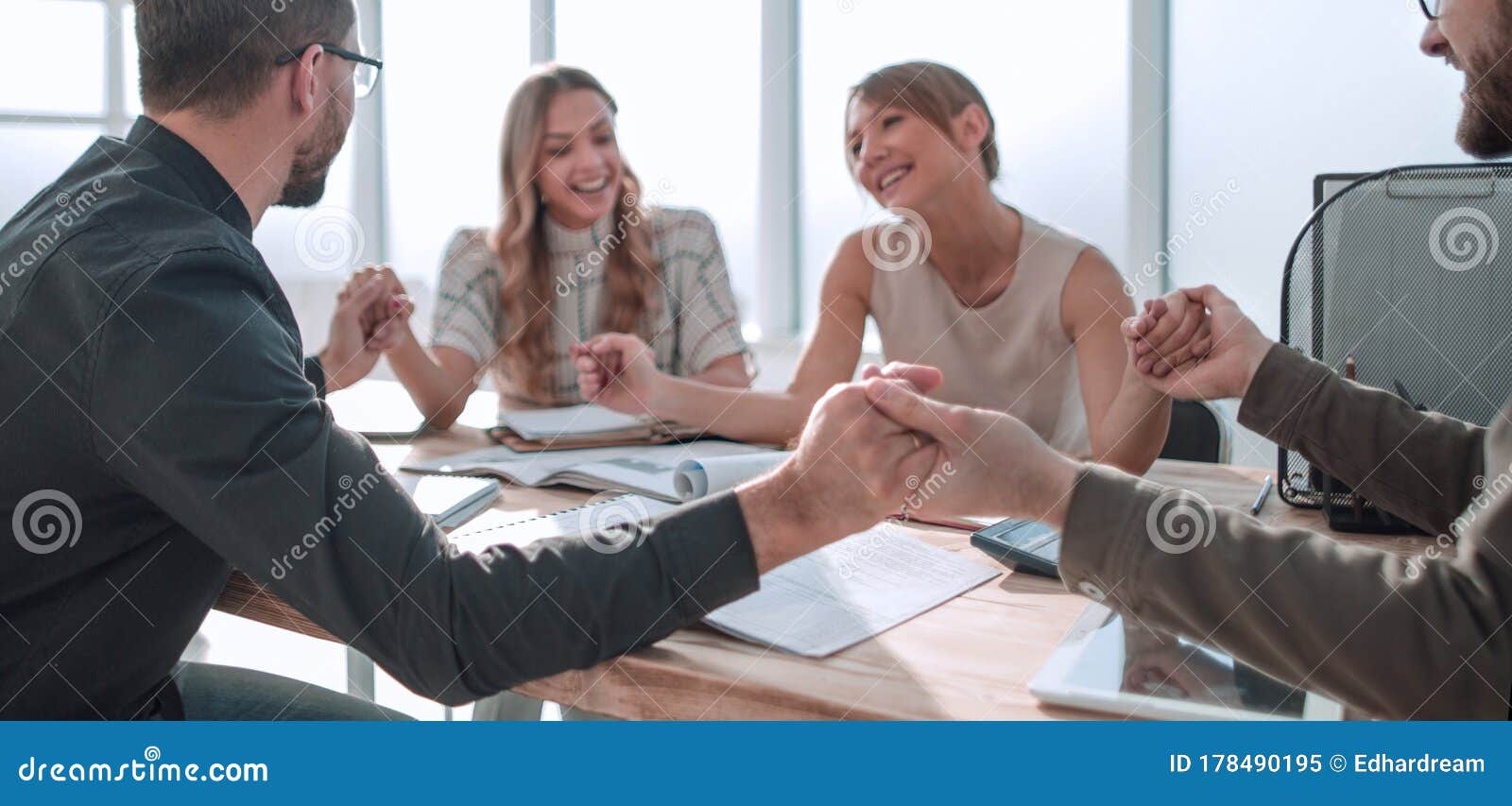 Business Team Sitting at the Table and Showing Their Unity Stock Image ...