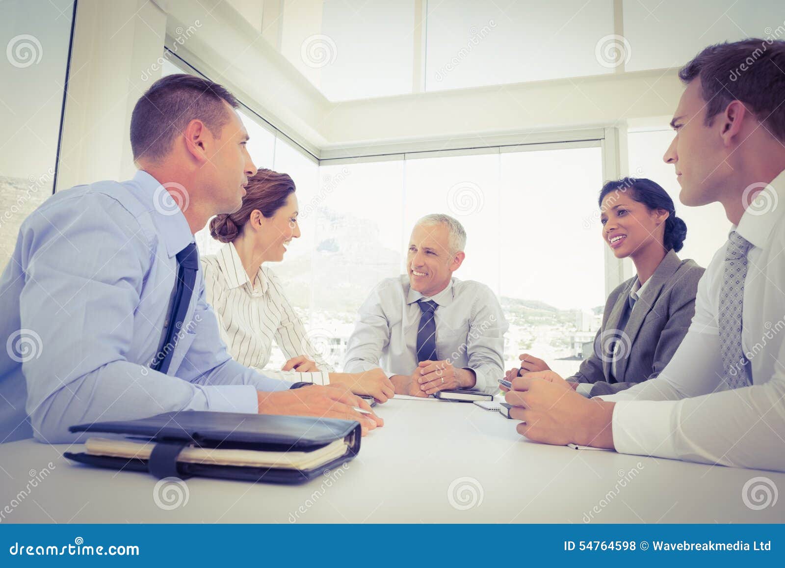 Business Team Sitting Together Around the Table Stock Photo - Image of ...