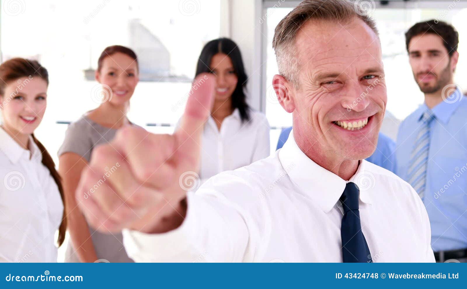 Business Team Smiling at the Camera with Boss Showing Thumbs Up Stock ...