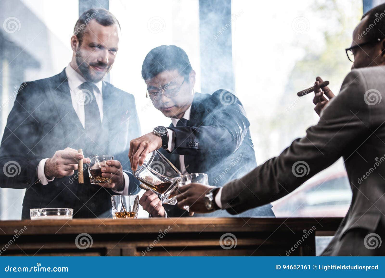 Business Team Spending Time, Smoking Cigars and Drinking Whiskey Stock ...
