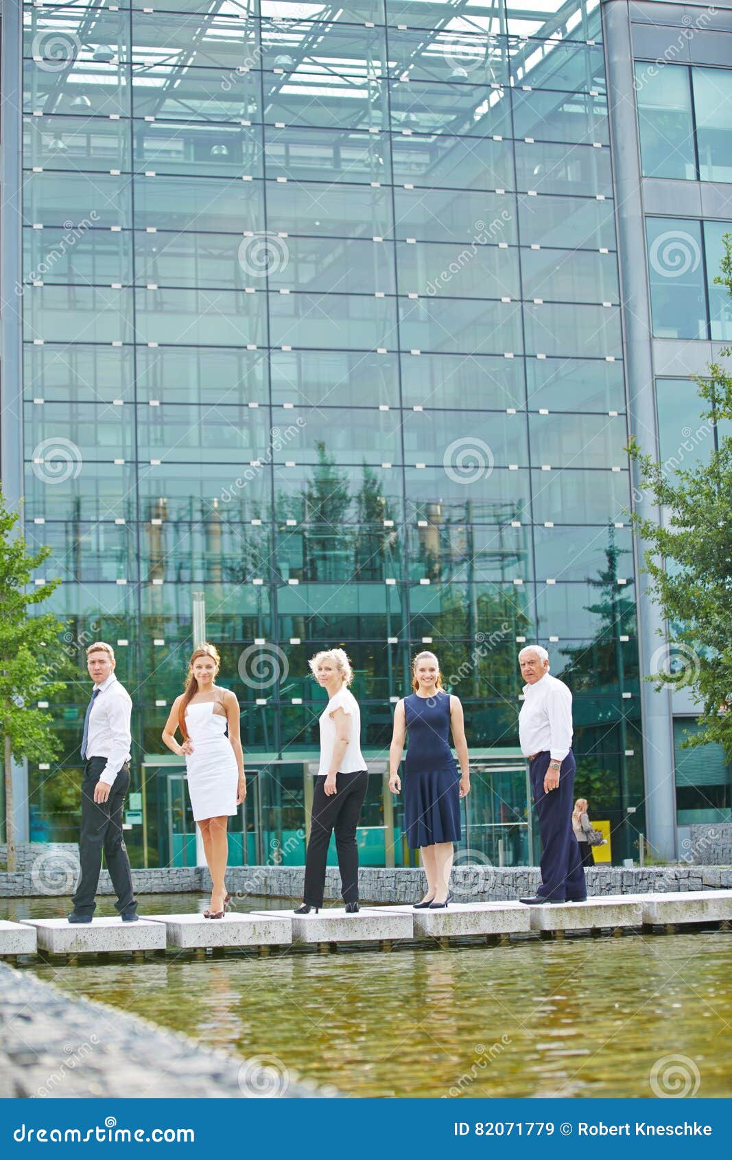 Business Team Standing in Front of Office Stock Image - Image of office ...