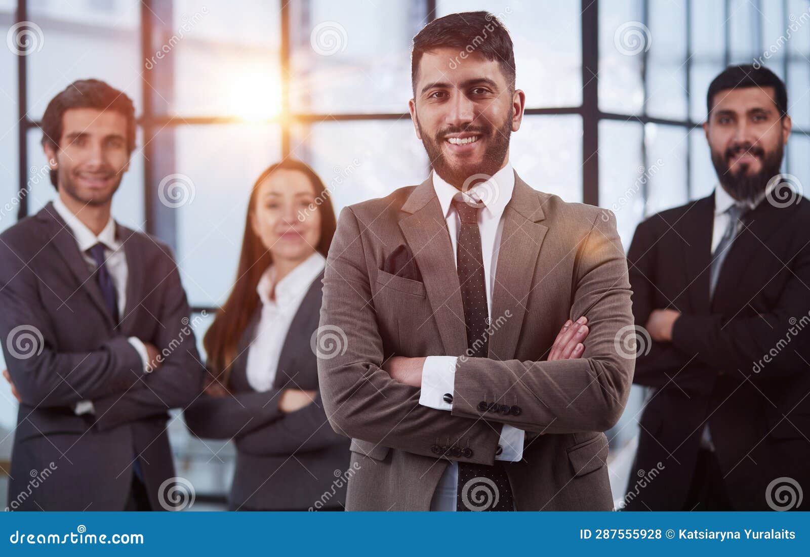 Four Business People Posing in a Modern Setting Stock Photo - Image of ...
