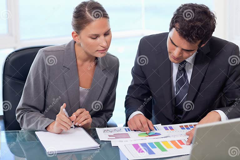 Business Team Studying Statistics Stock Photo - Image of cooperation ...