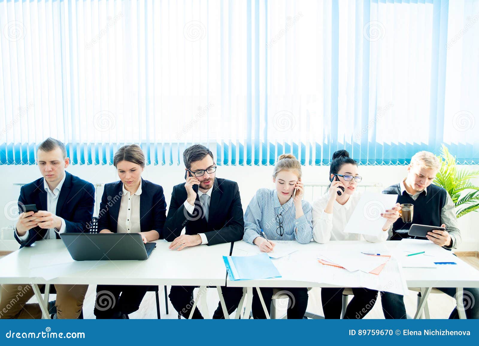 Business team at table stock photo. Image of looking - 89759670