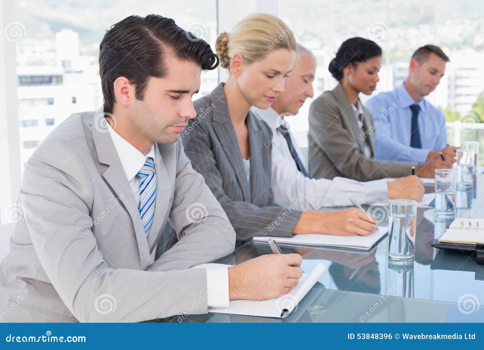 Business Team Taking Notes during Conference Stock Photo - Image of ...