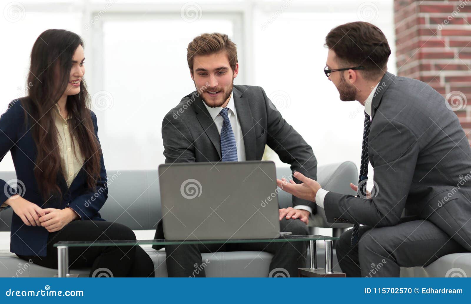 A Business Team of Three Planning Work in Office. Stock Photo - Image ...