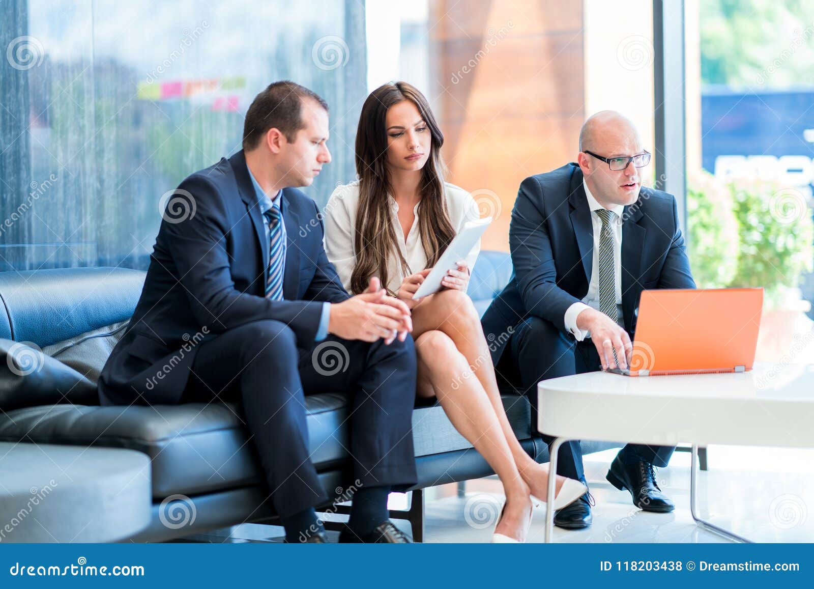 A Business Team of Three Sitting in Office and Planning Work. Us Stock ...